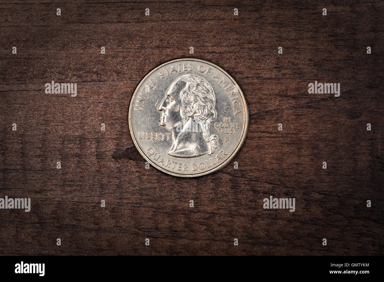 Quarter on Wood Stock Photo - Alamy