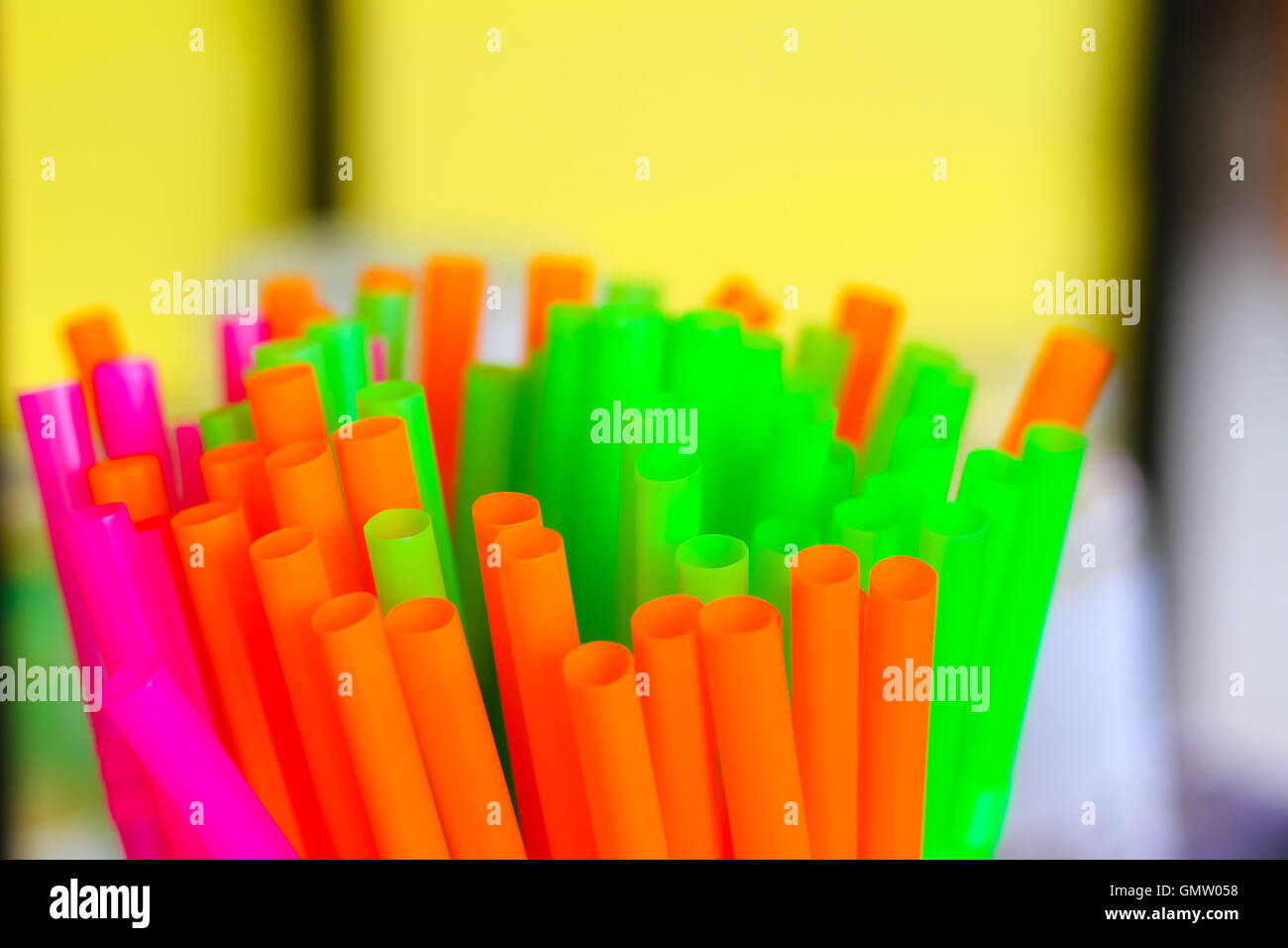 Straw plastic tube color full, selected focus Stock Photo - Alamy