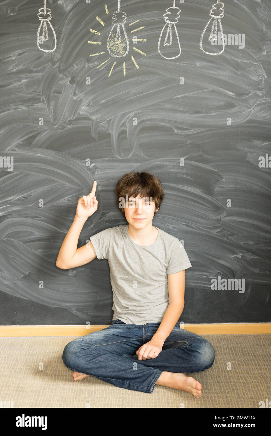 Teenager boy getting an idea Stock Photo - Alamy