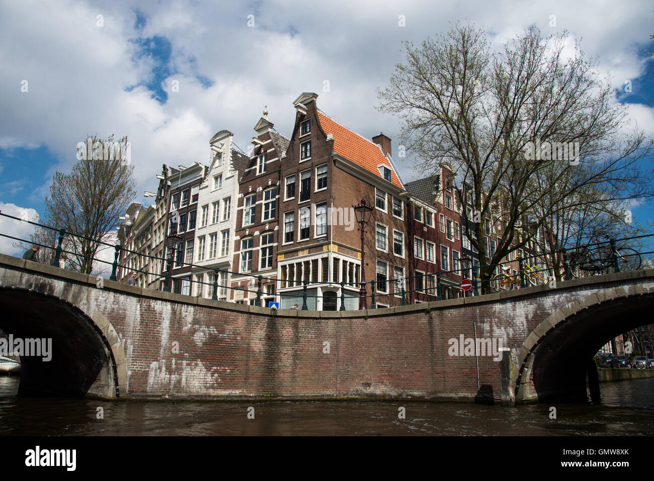 historic buildings and canal in historic amsterdam Stock Photo - Alamy