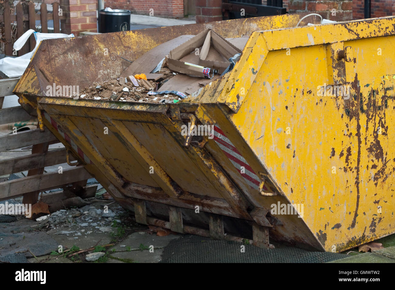 Skip full building rubble bricks hi-res stock photography and images ...