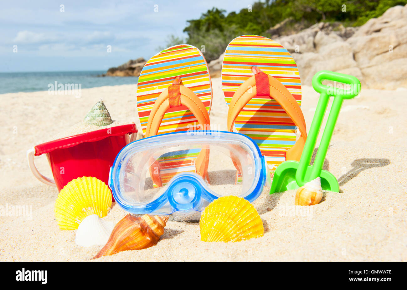 Seashells and diving mask on the beach Stock Photo - Alamy