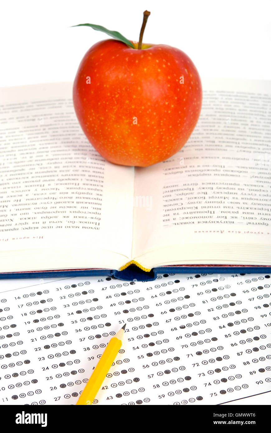 Test score sheet with apple and books Stock Photo - Alamy