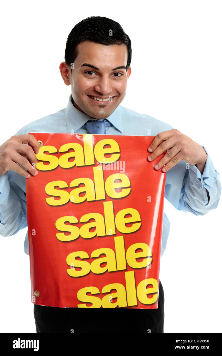 Retailer with sale sign Stock Photo - Alamy
