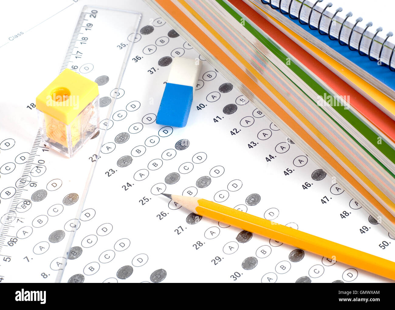 Test score with pencil, notebook and eraser Stock Photo - Alamy