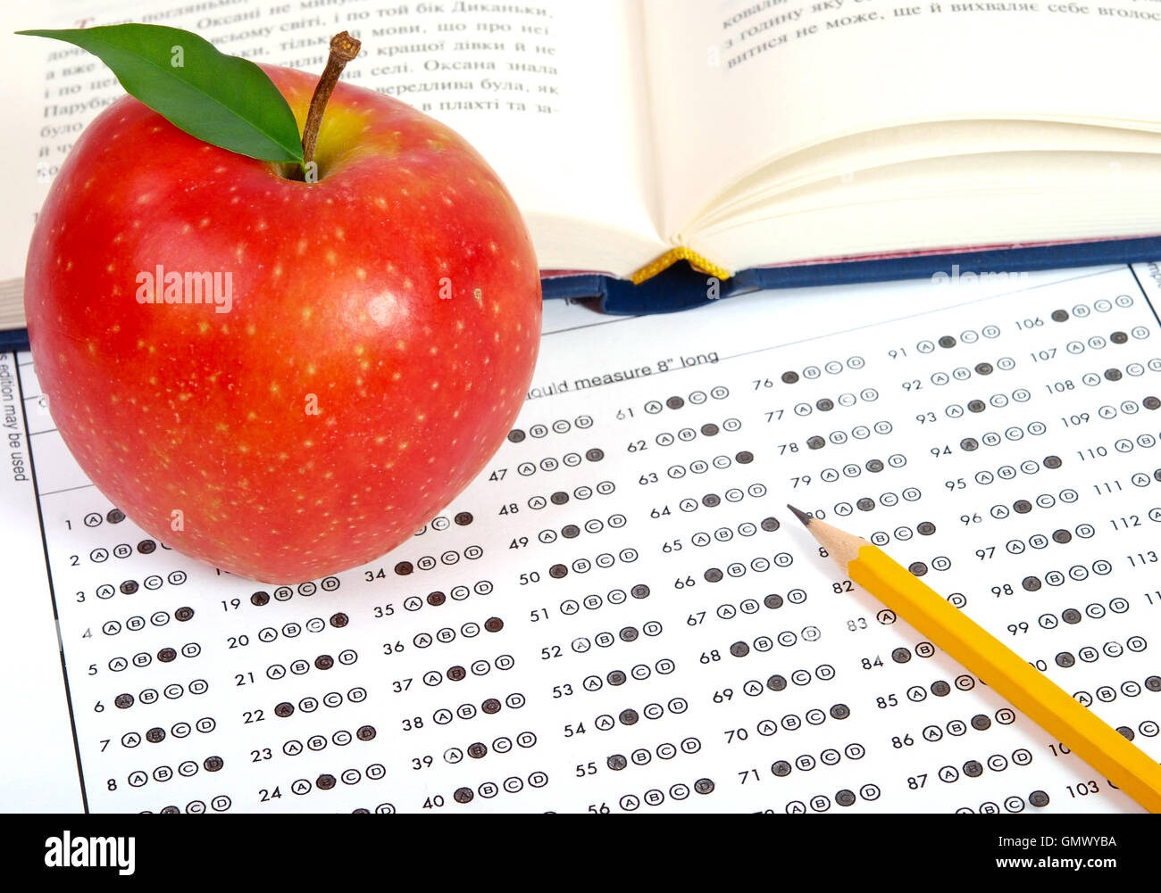 Test score sheet with apple and books Stock Photo - Alamy