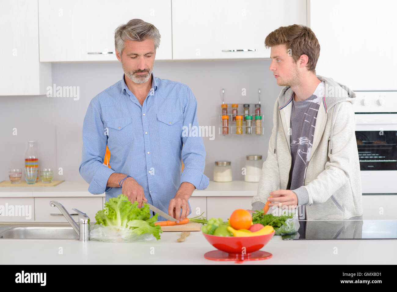 men preparing lunch Stock Photo - Alamy