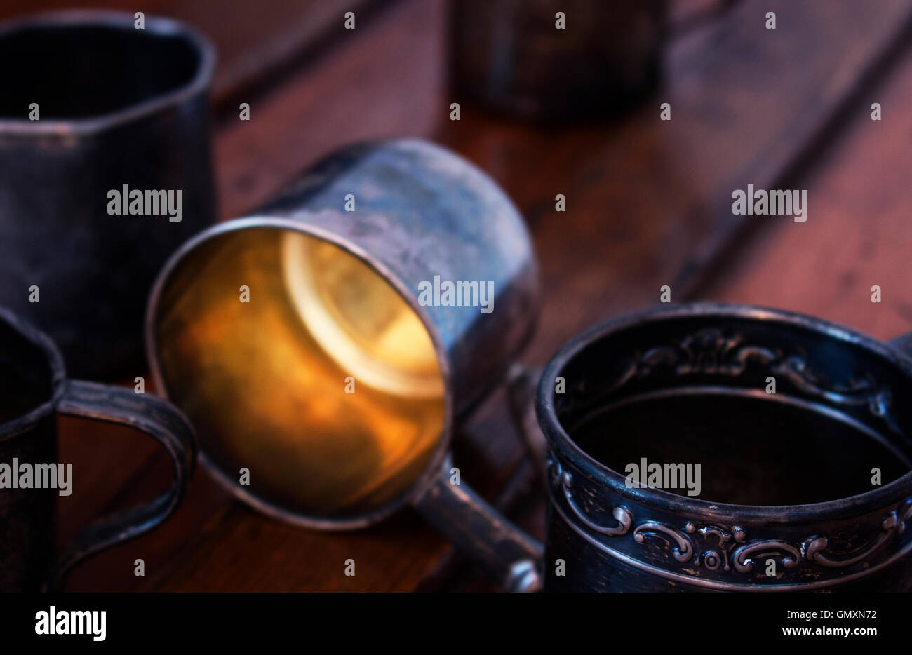 Old overturned metal cups Stock Photo - Alamy