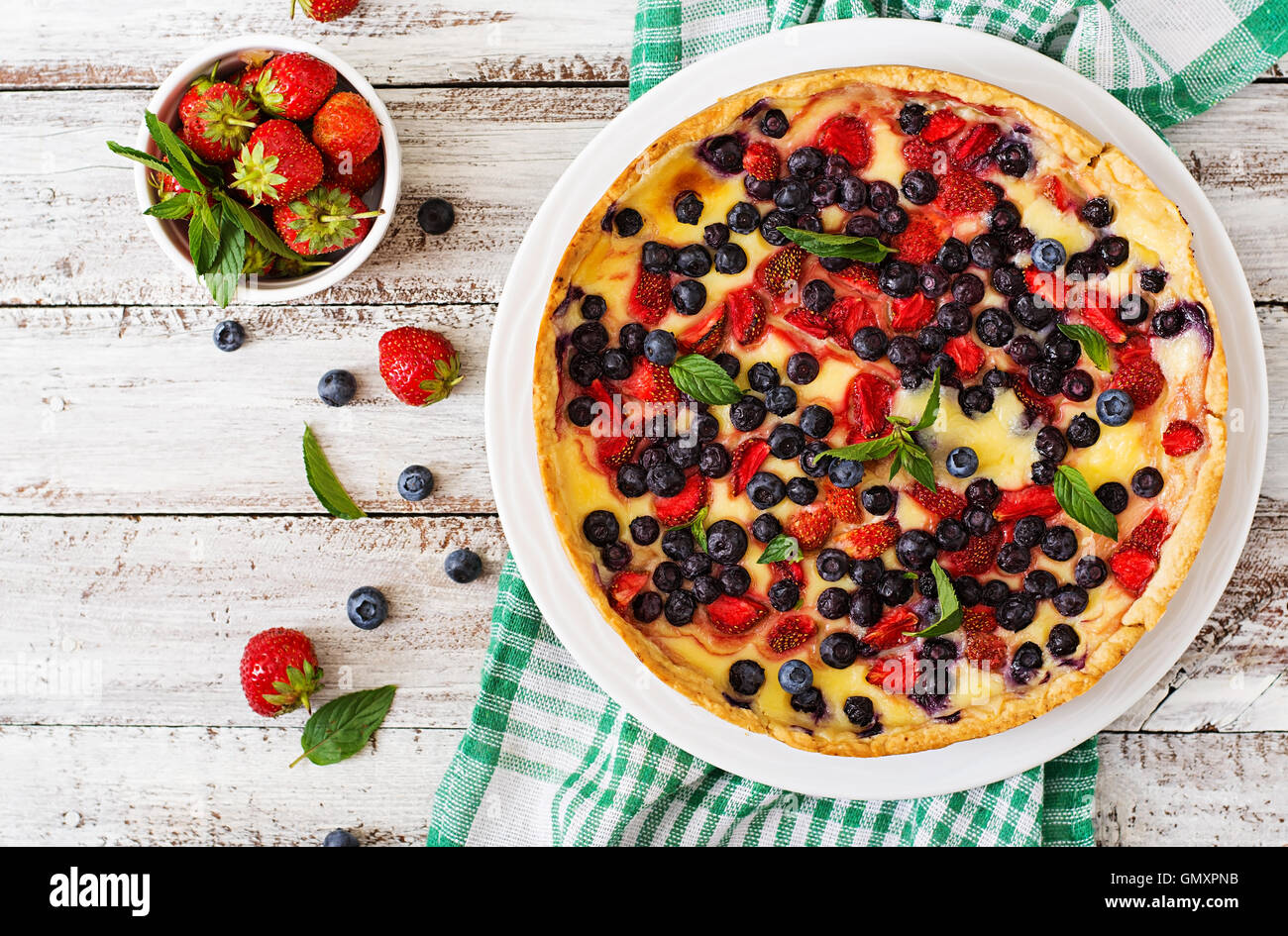French tart (flan) with berries and custard. Top view Stock Photo - Alamy