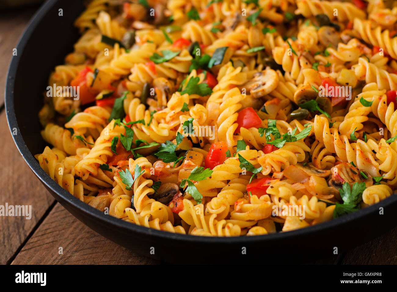 Vegetarian Vegetable pasta Fusilli with zucchini, mushrooms and capers ...