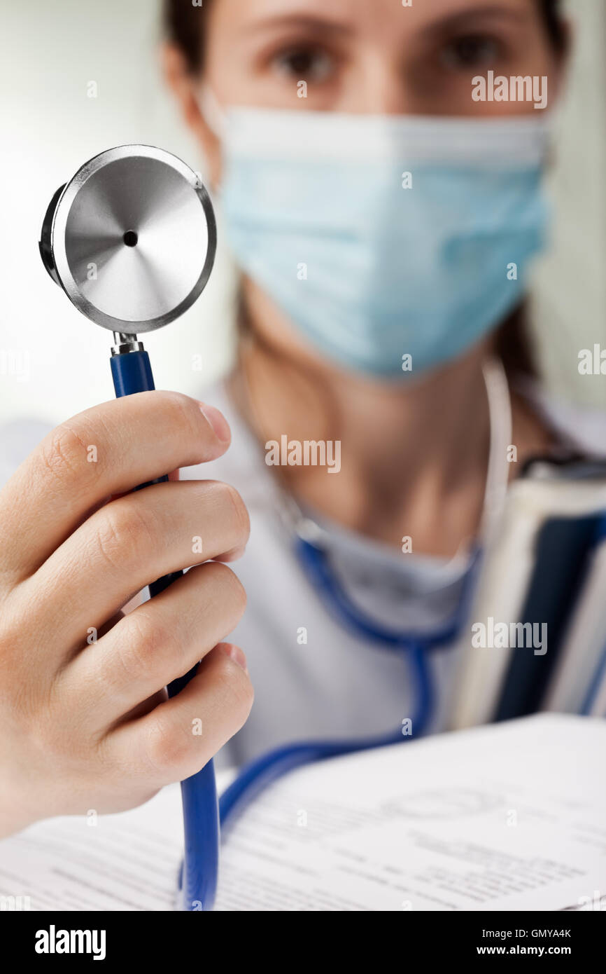 Doctor holding stethoscope Stock Photo - Alamy