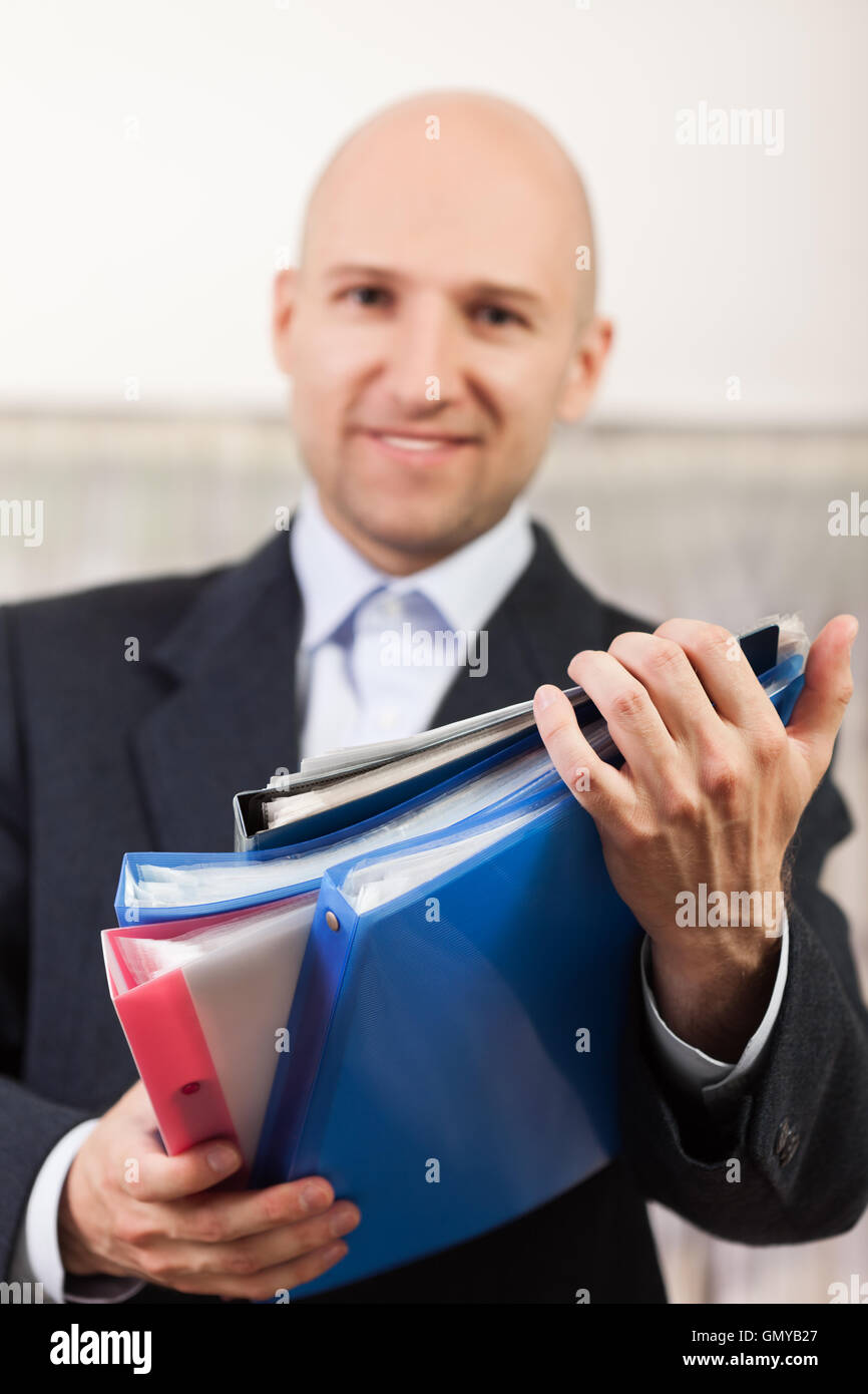 Business paper files in hand Stock Photo - Alamy