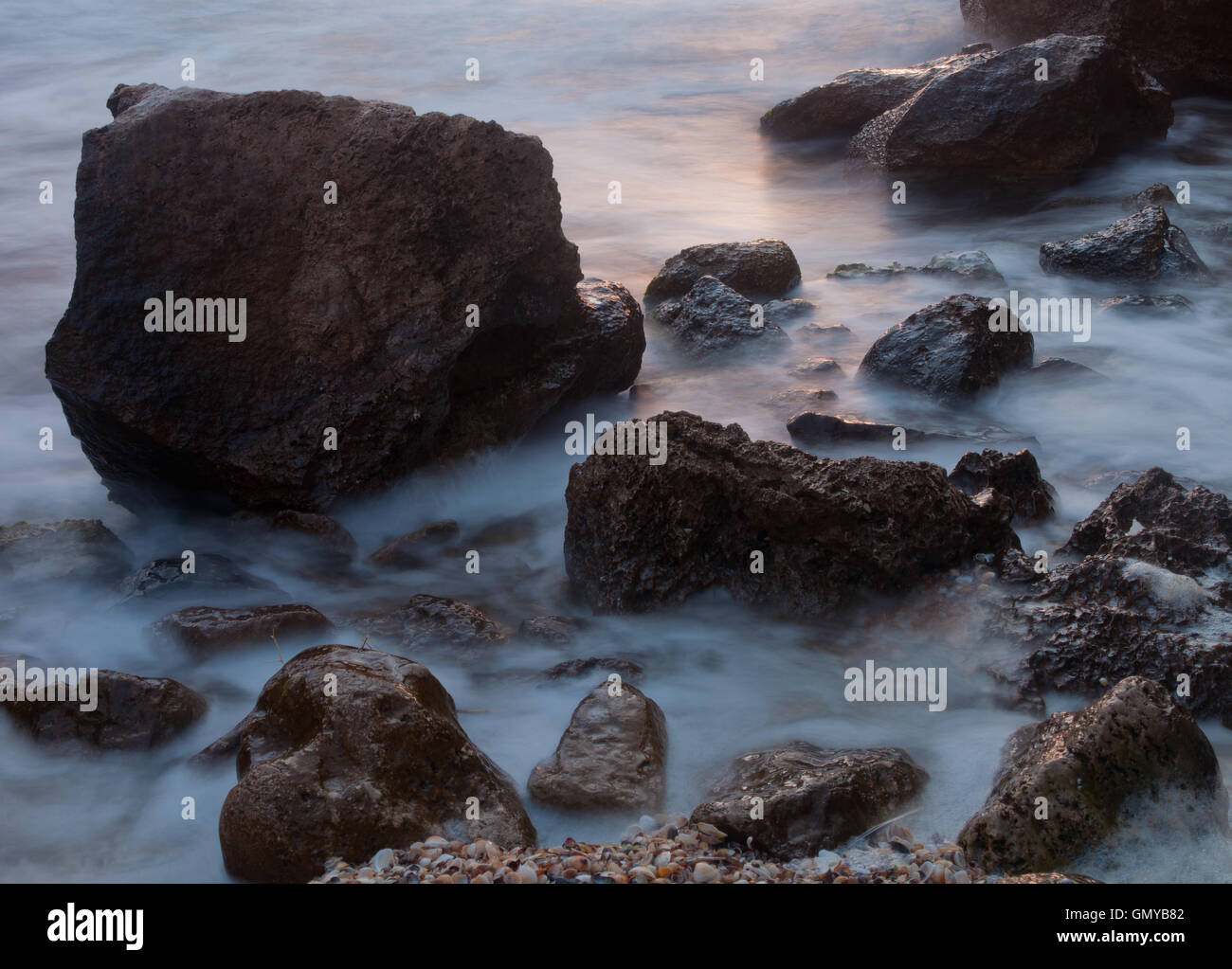 Calming rocky sea coast Stock Photo - Alamy