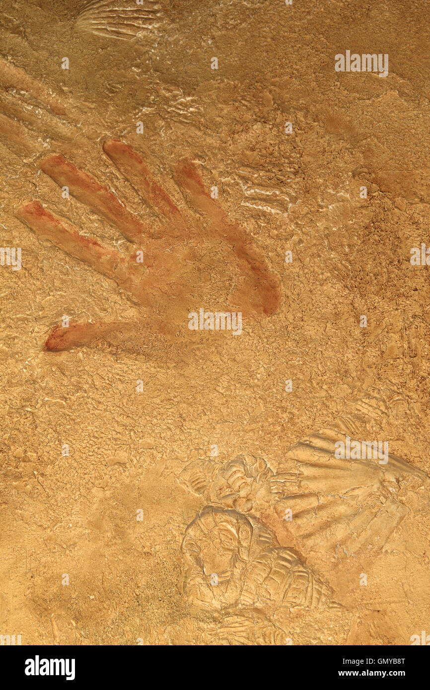 Red hand print on stone Stock Photo - Alamy