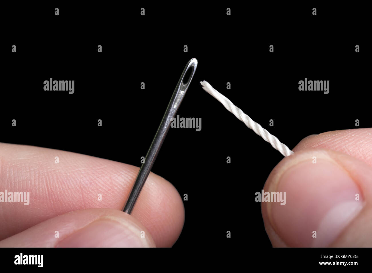 Sewing needle and thread Stock Photo - Alamy