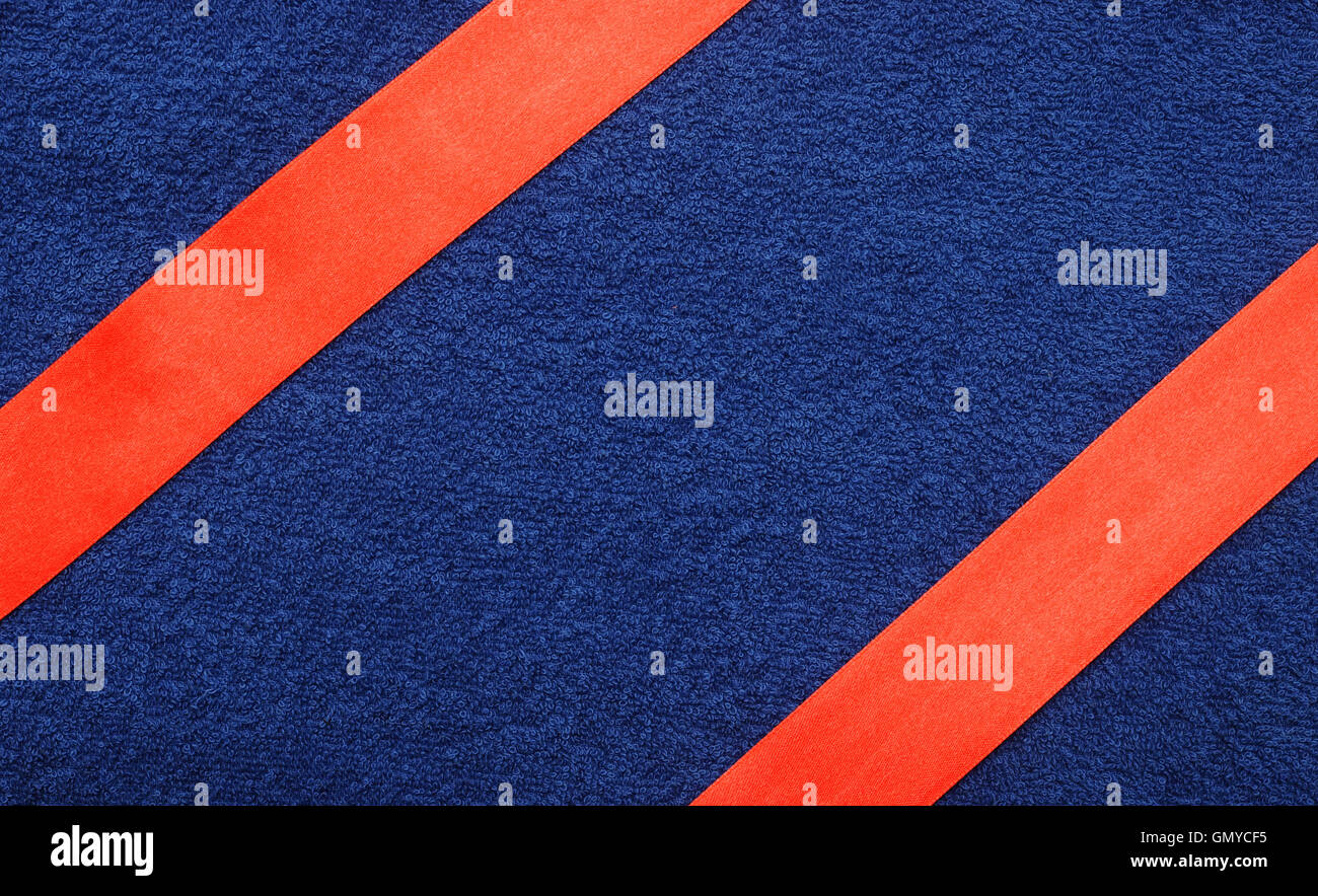 A wrapping red ribbon gift on blue background Stock Photo - Alamy