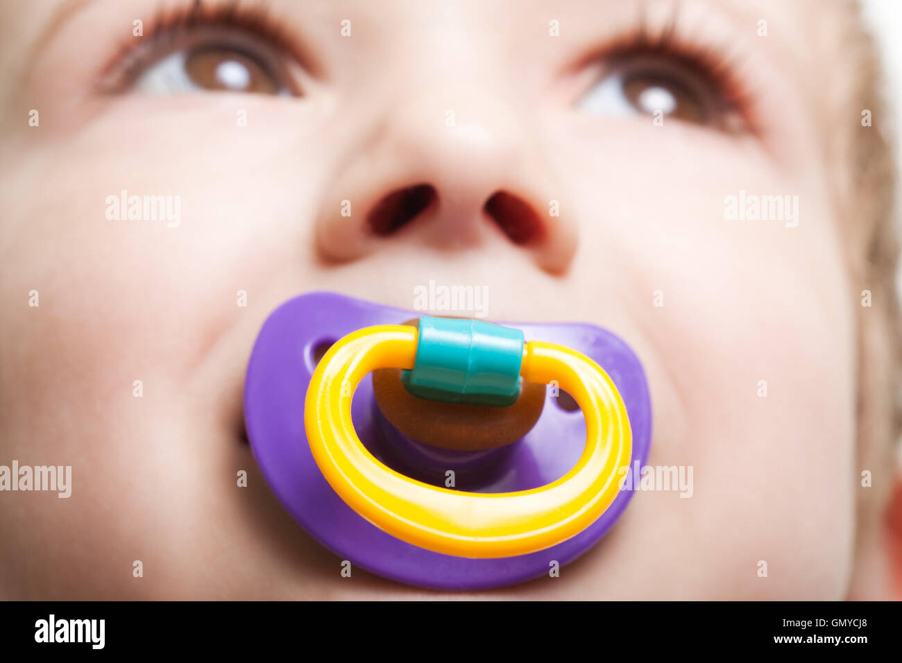Child with baby pacifier Stock Photo - Alamy