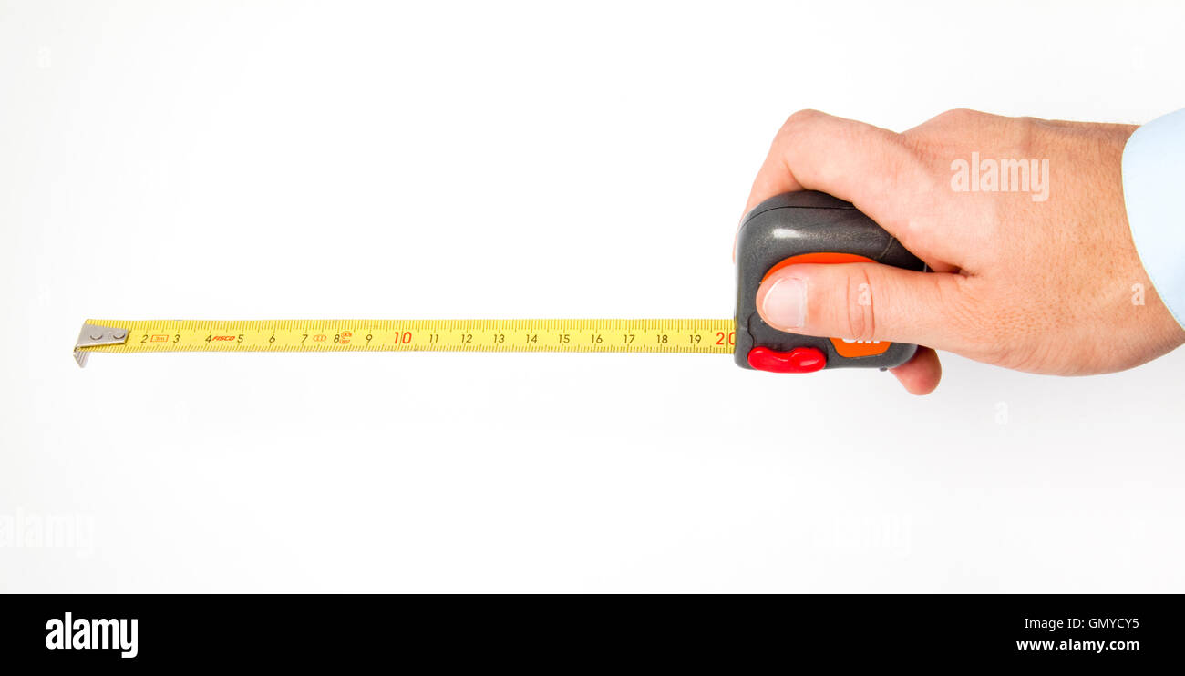 Hand holding a measuring roulette Stock Photo - Alamy