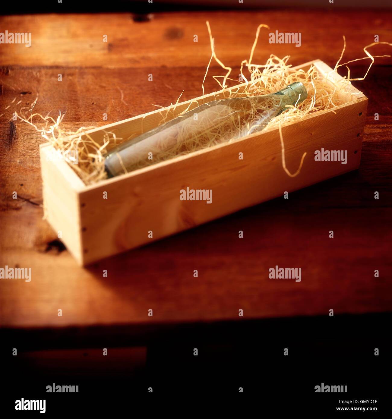 bottle in wooden box Stock Photo - Alamy