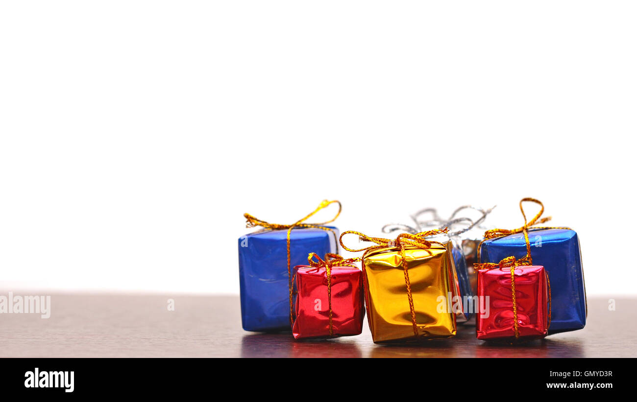 Closeup of colorful gifts box on wood background Stock Photo - Alamy