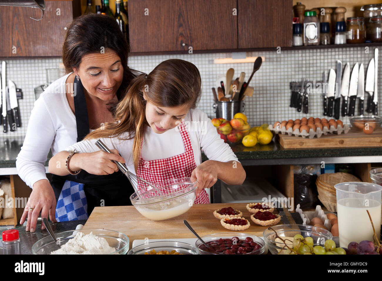 Mother and daughter baking at home Stock Photo - Alamy