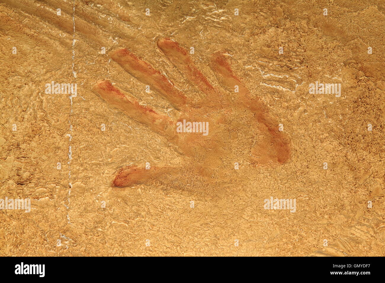 Red hand print on stone Stock Photo - Alamy