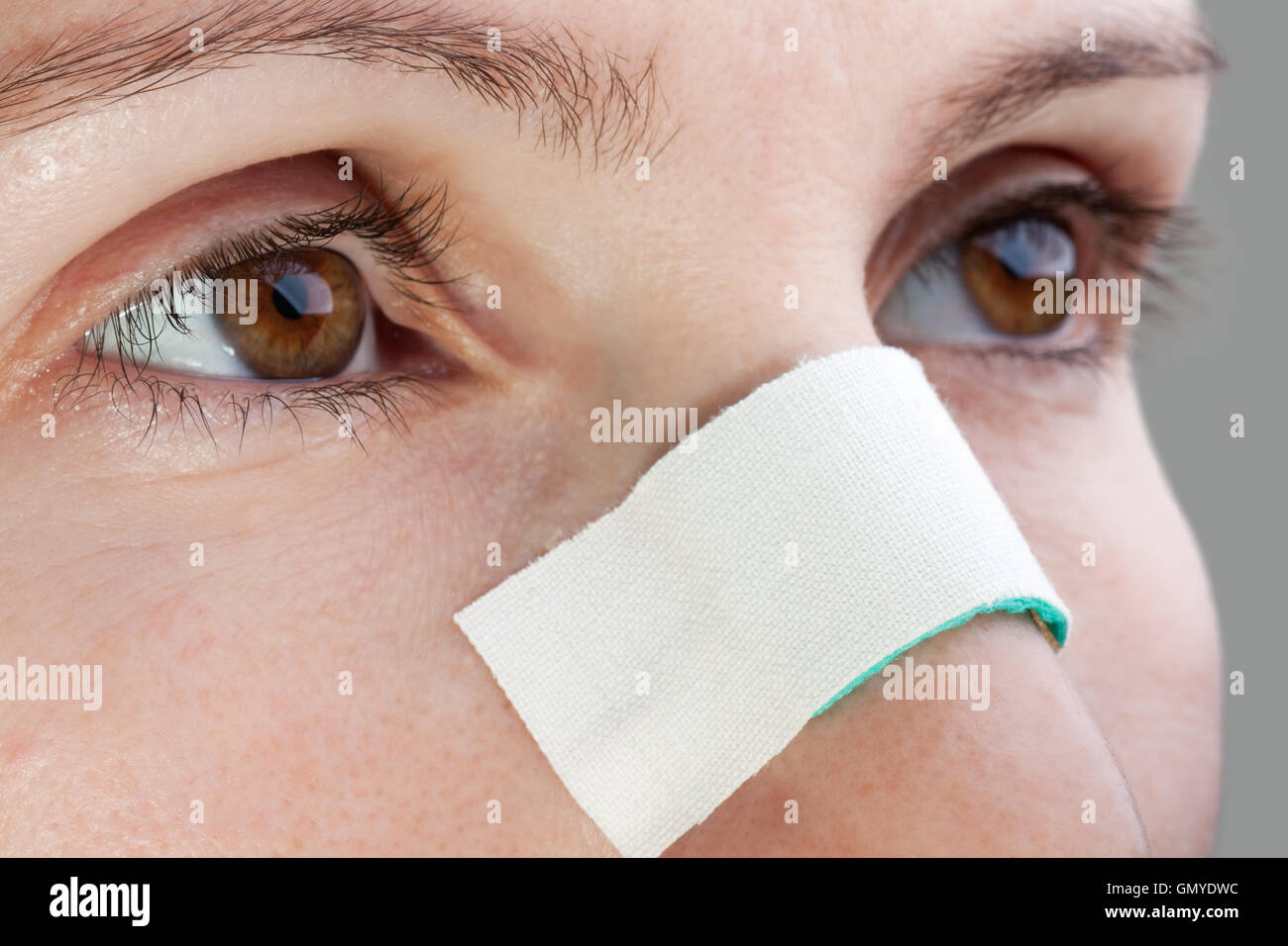 Plaster on wound nose Stock Photo - Alamy