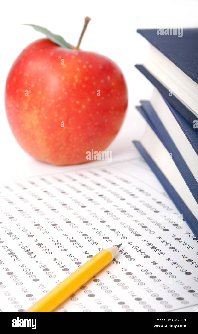 Test score sheet with apple and books Stock Photo - Alamy