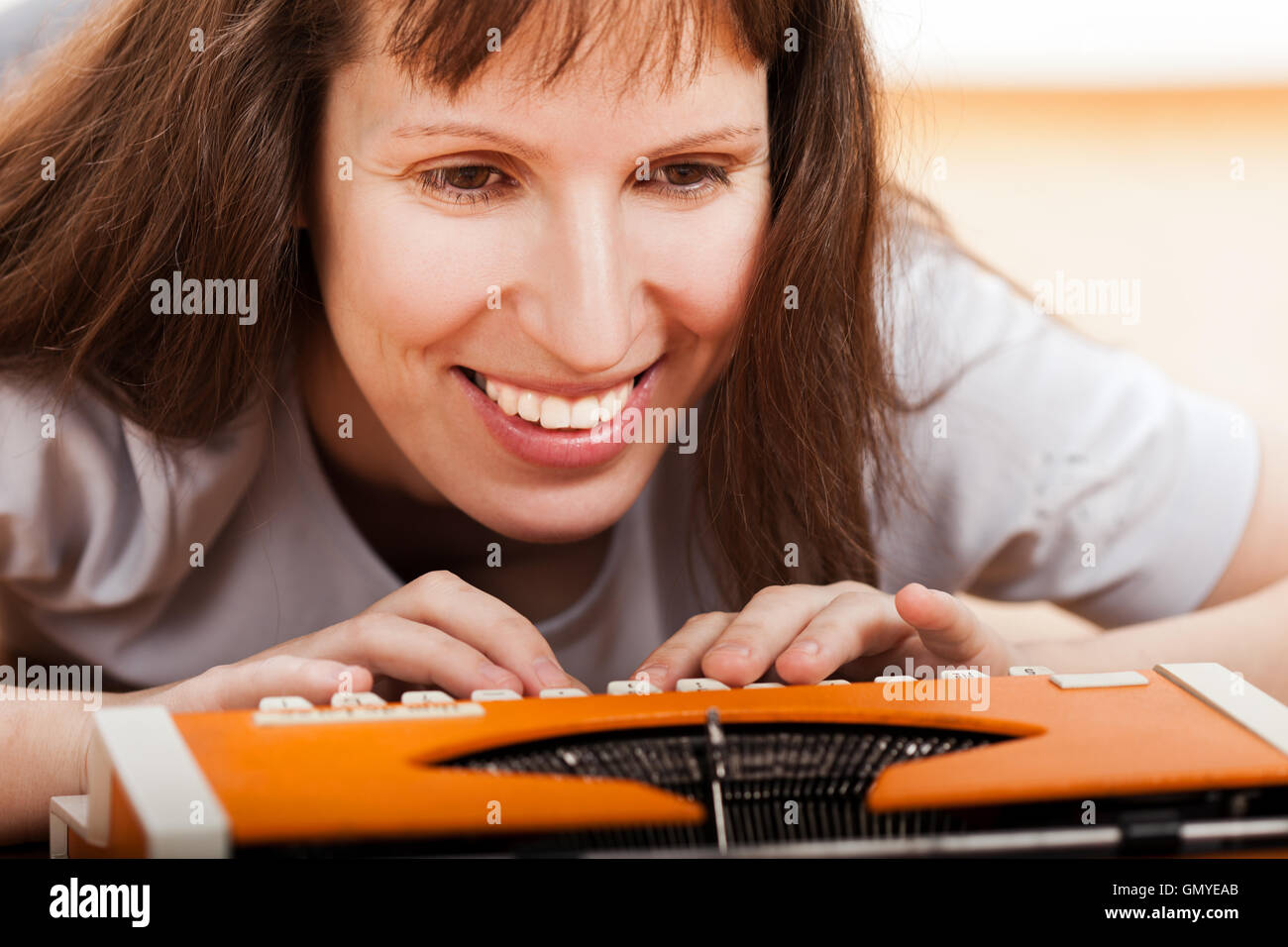 Woman typing typewriter Stock Photo - Alamy