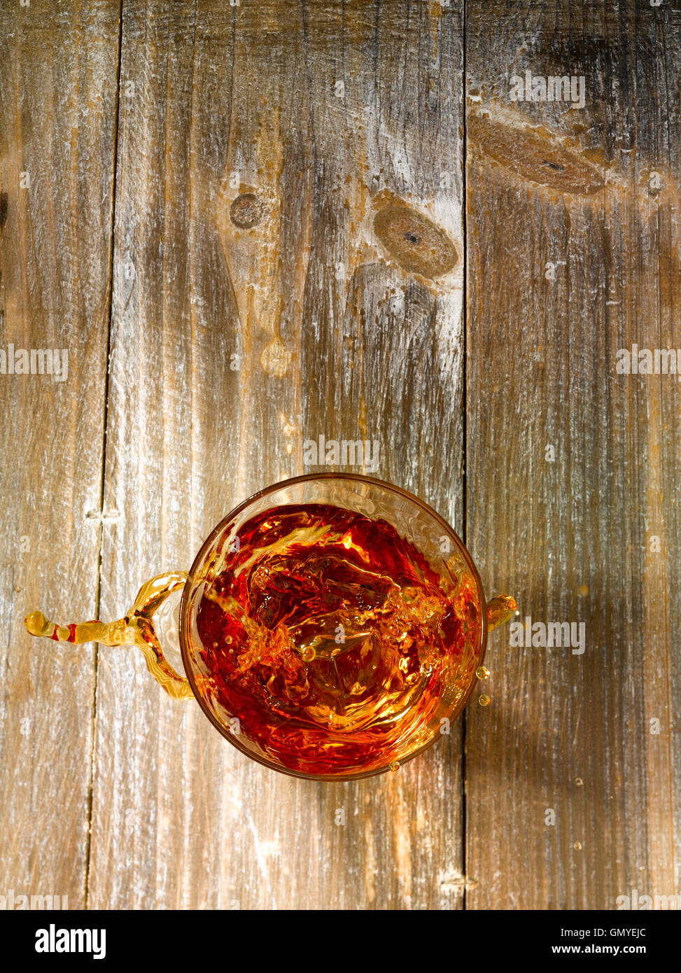 Splash of whiskey Stock Photo - Alamy