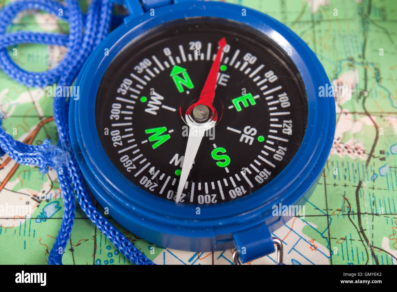 Compass and map Stock Photo - Alamy