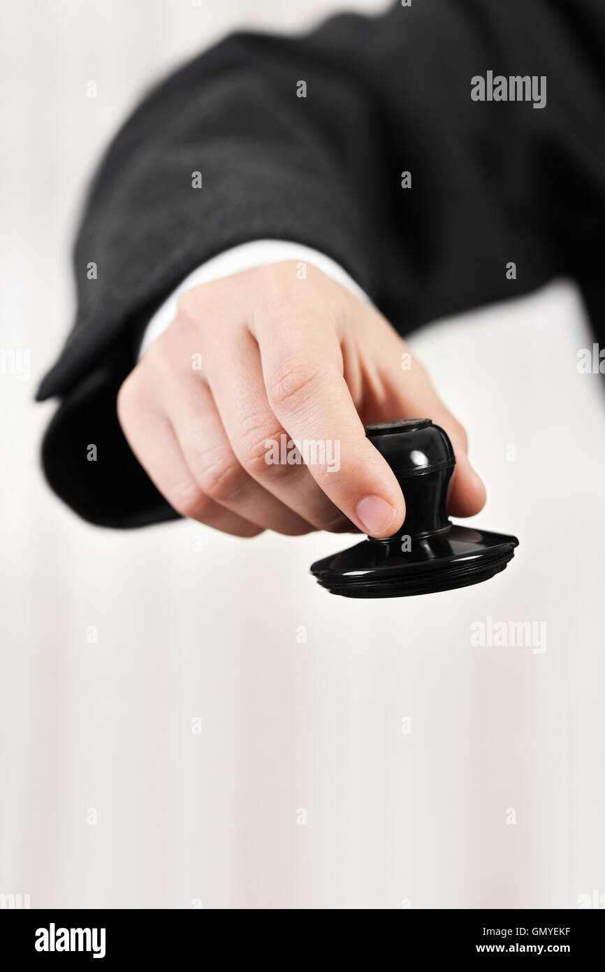 Hand holding stamp Stock Photo - Alamy