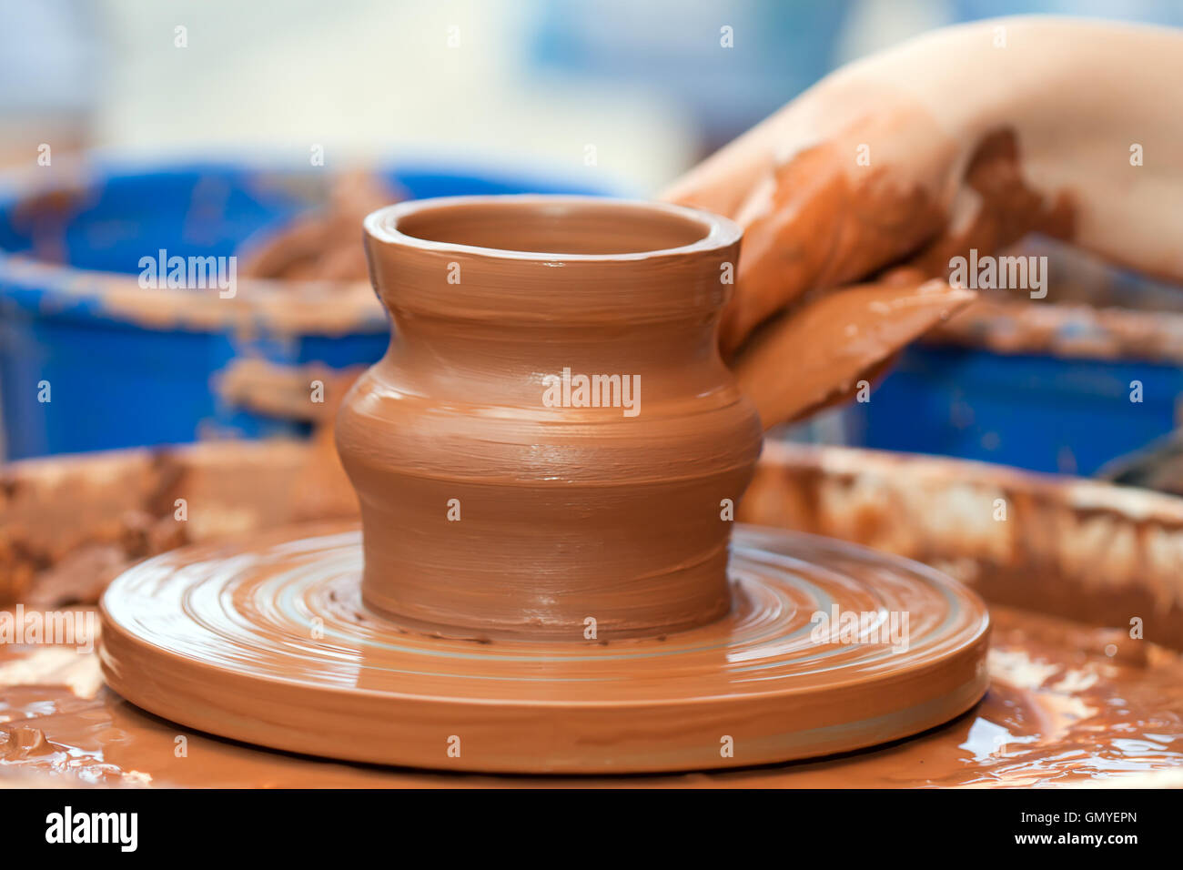 Clay potter hand Stock Photo - Alamy