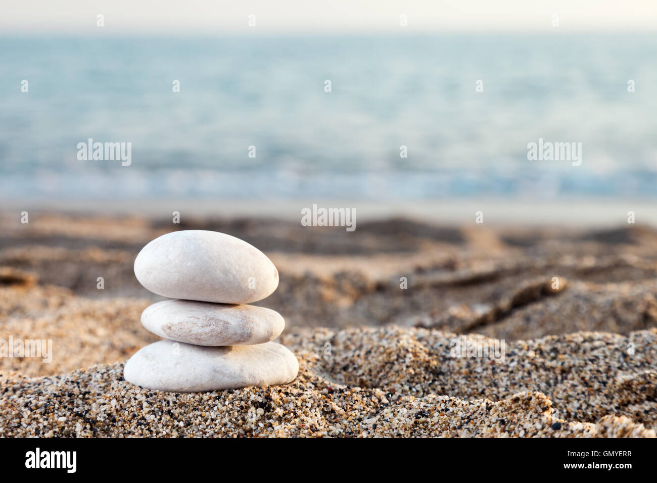 Stack or pile of balancing stones on sea beach Stock Photo - Alamy