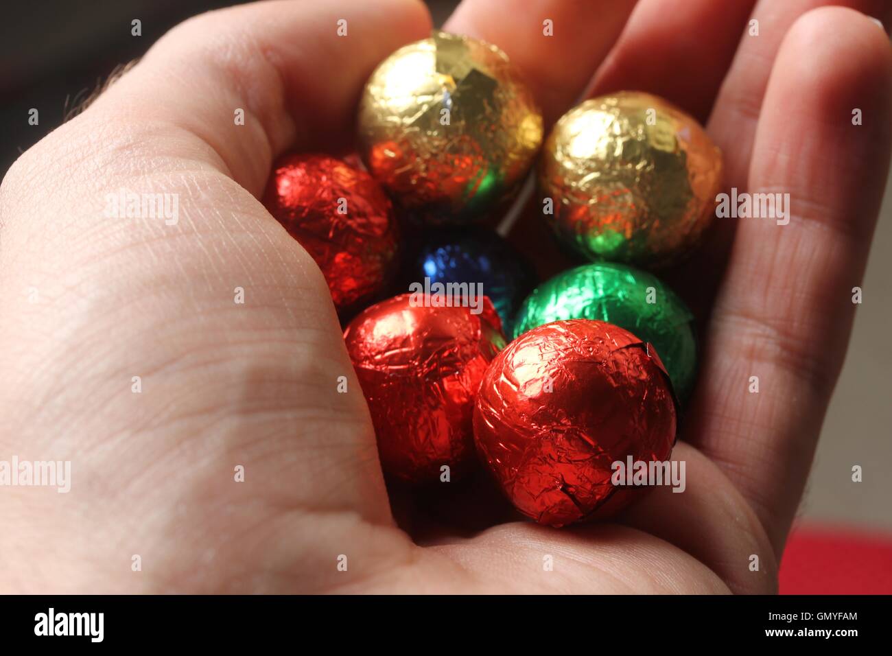 a hand full of sweets Stock Photo - Alamy