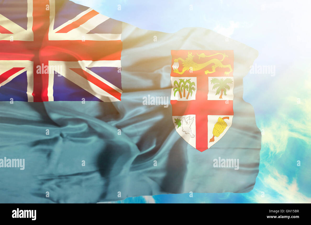 Fiji waving flag against blue sky with sunrays Stock Photo - Alamy
