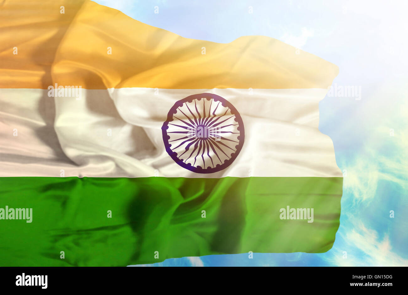 India waving flag against blue sky with sunrays Stock Photo - Alamy