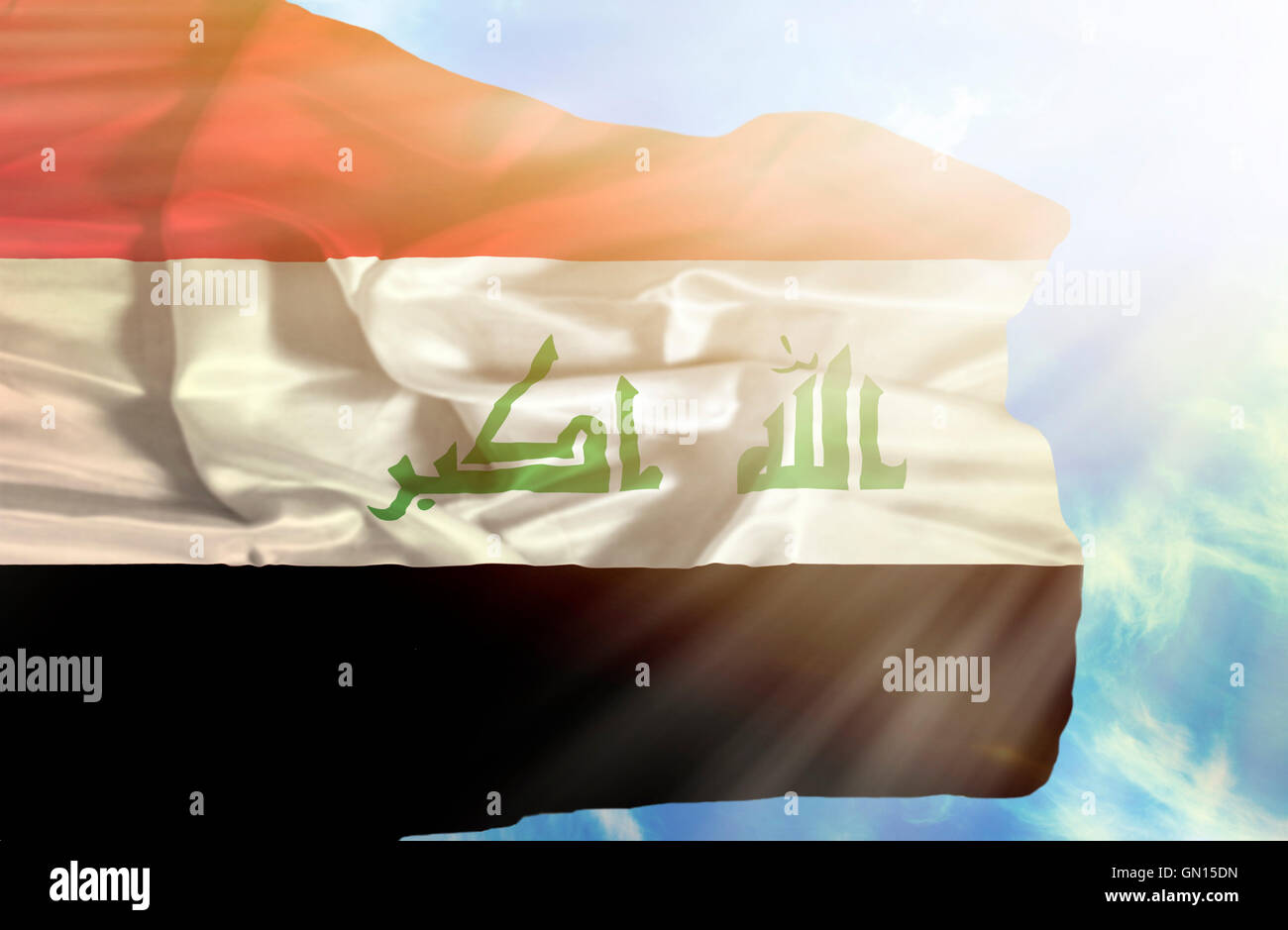 Iraq waving flag against blue sky with sunrays Stock Photo - Alamy