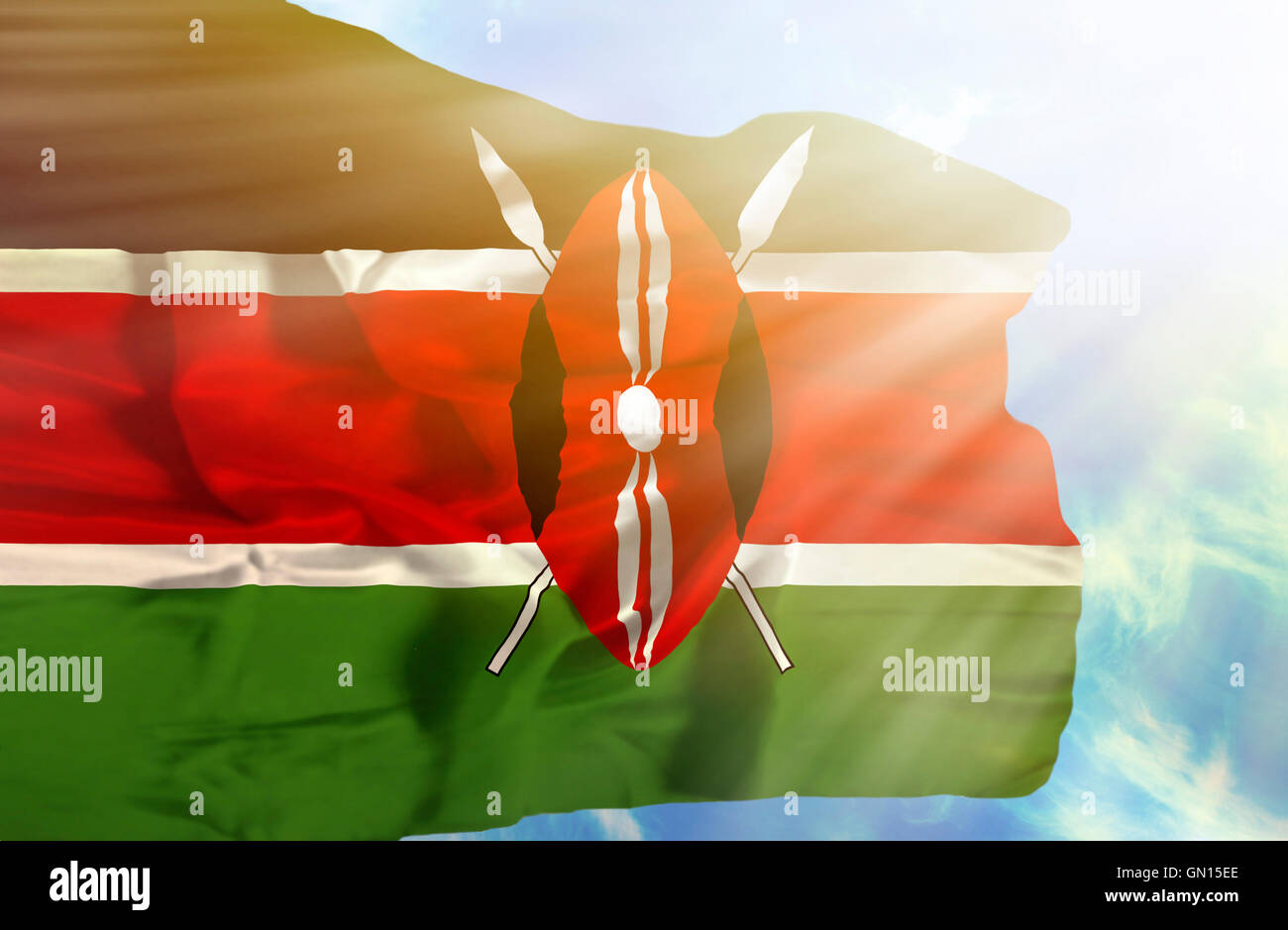 Kenya waving flag against blue sky with sunrays Stock Photo - Alamy