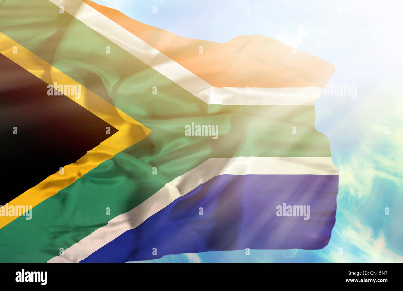 South Africa waving flag against blue sky with sunrays Stock Photo - Alamy