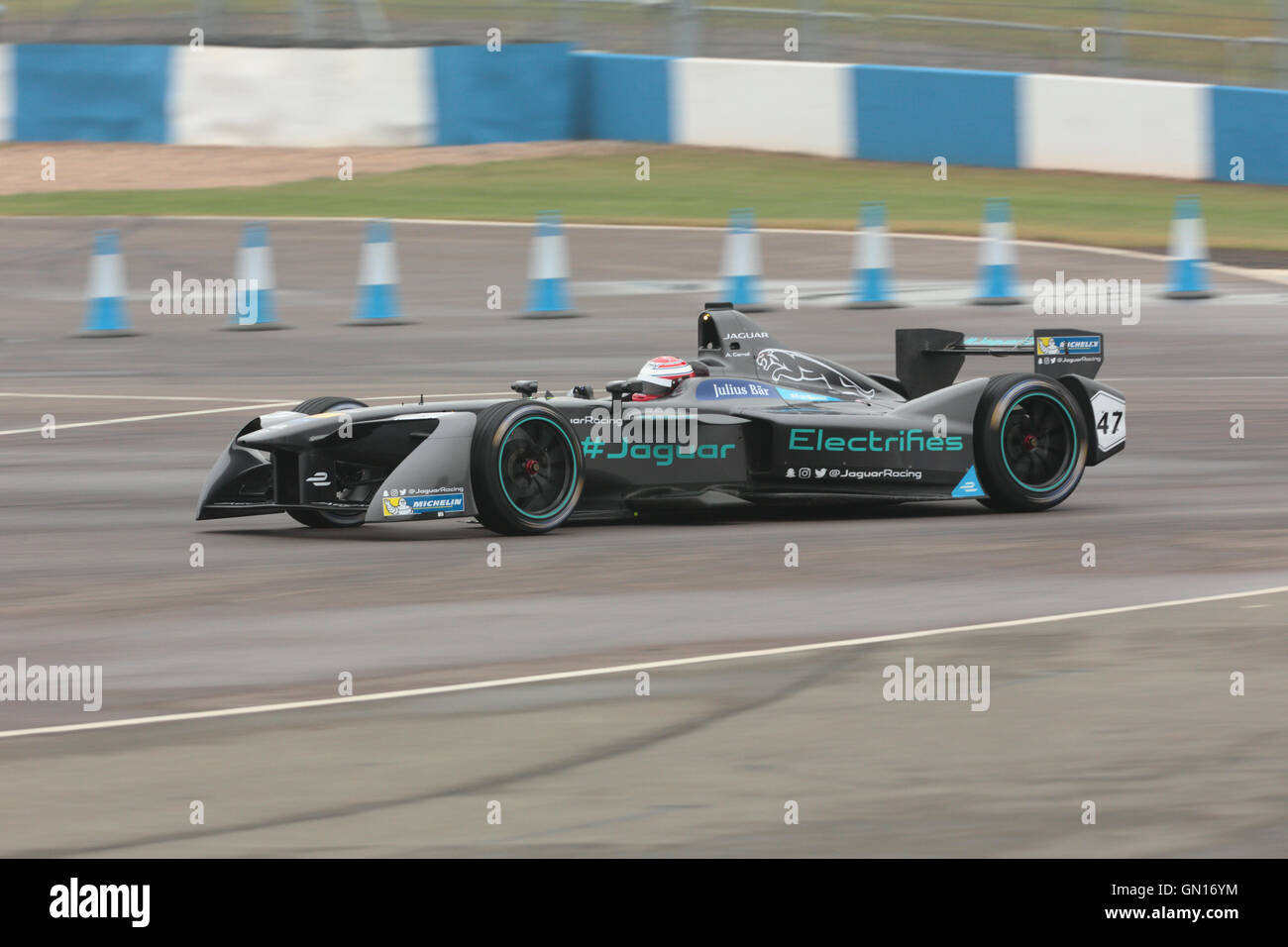 Adam Carroll driving racing car driven by battery from a testing day ...