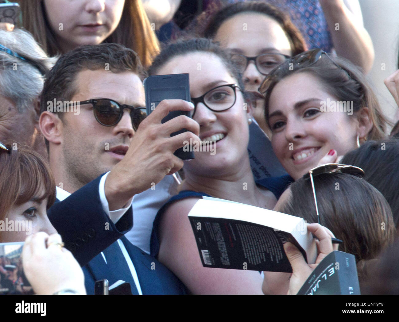 Jamie Dornan is mobbed by fans while heading to the set of 'Fifty ...