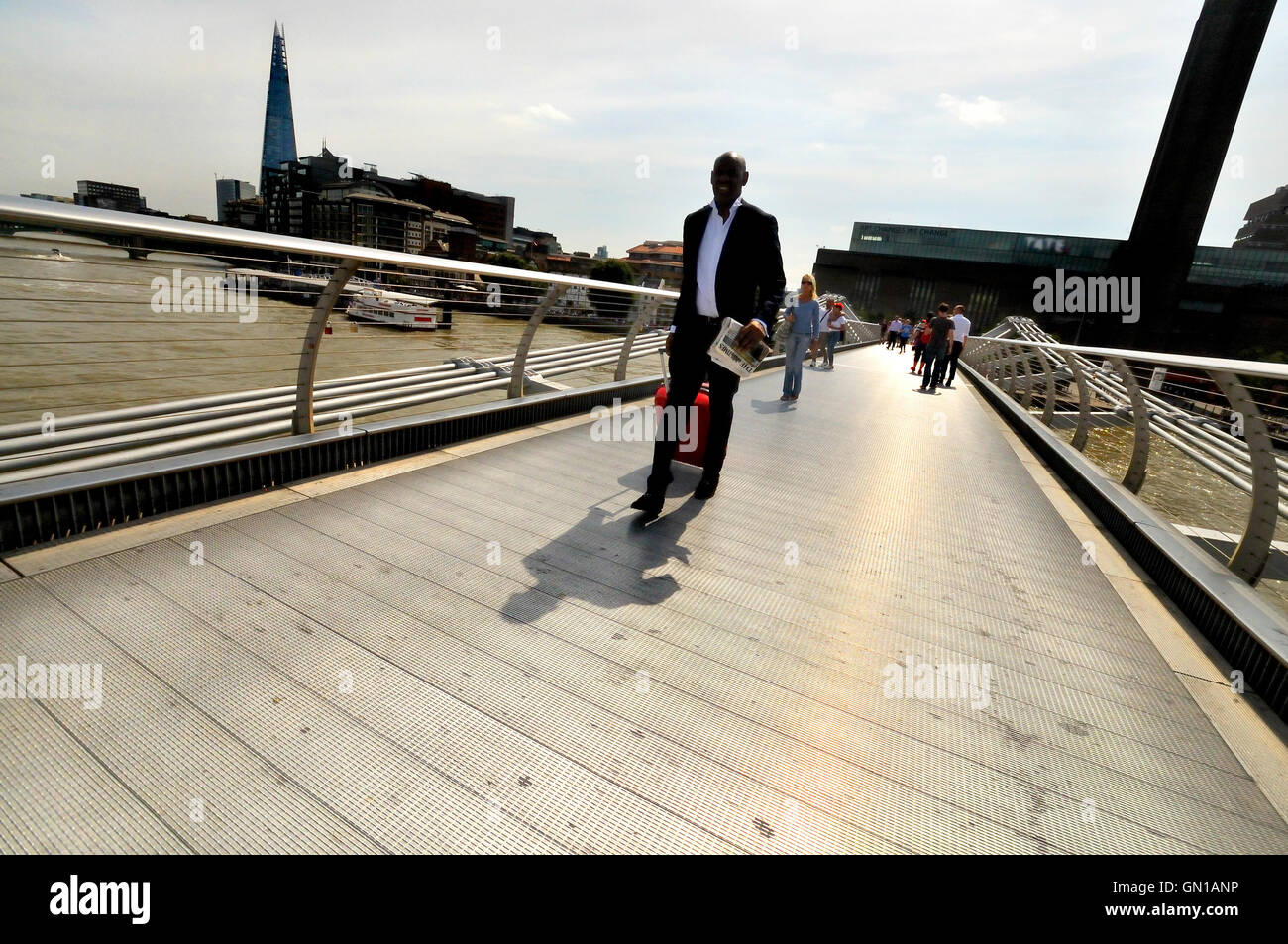 Man walking across bridge hi-res stock photography and images - Alamy