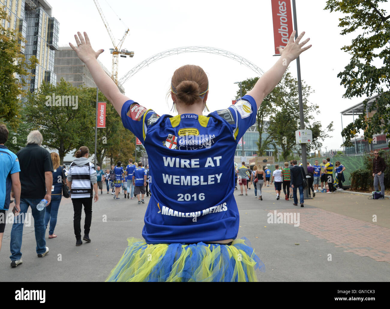 A Warrington Wolves fan arrives for the Challenge Cup Final match at ...
