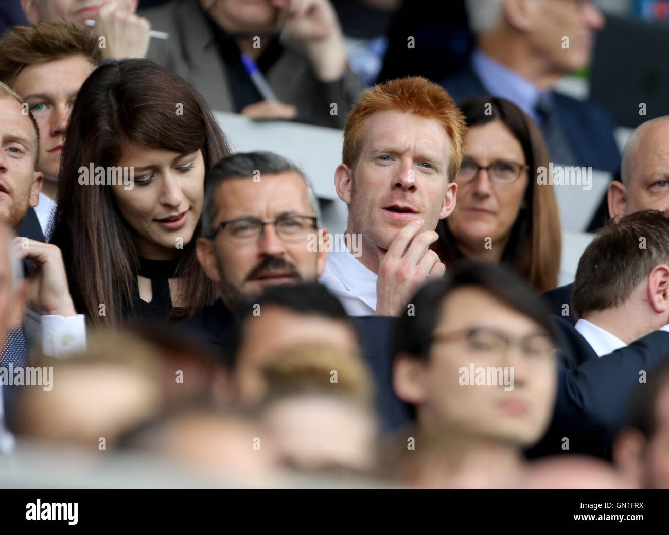 Team GB gold medal cyclist Ed Clancy watches the match during the Sky ...