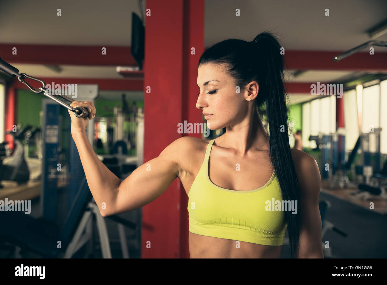 Beautiful fit woman working out in gym - girl in fitness Stock Photo ...