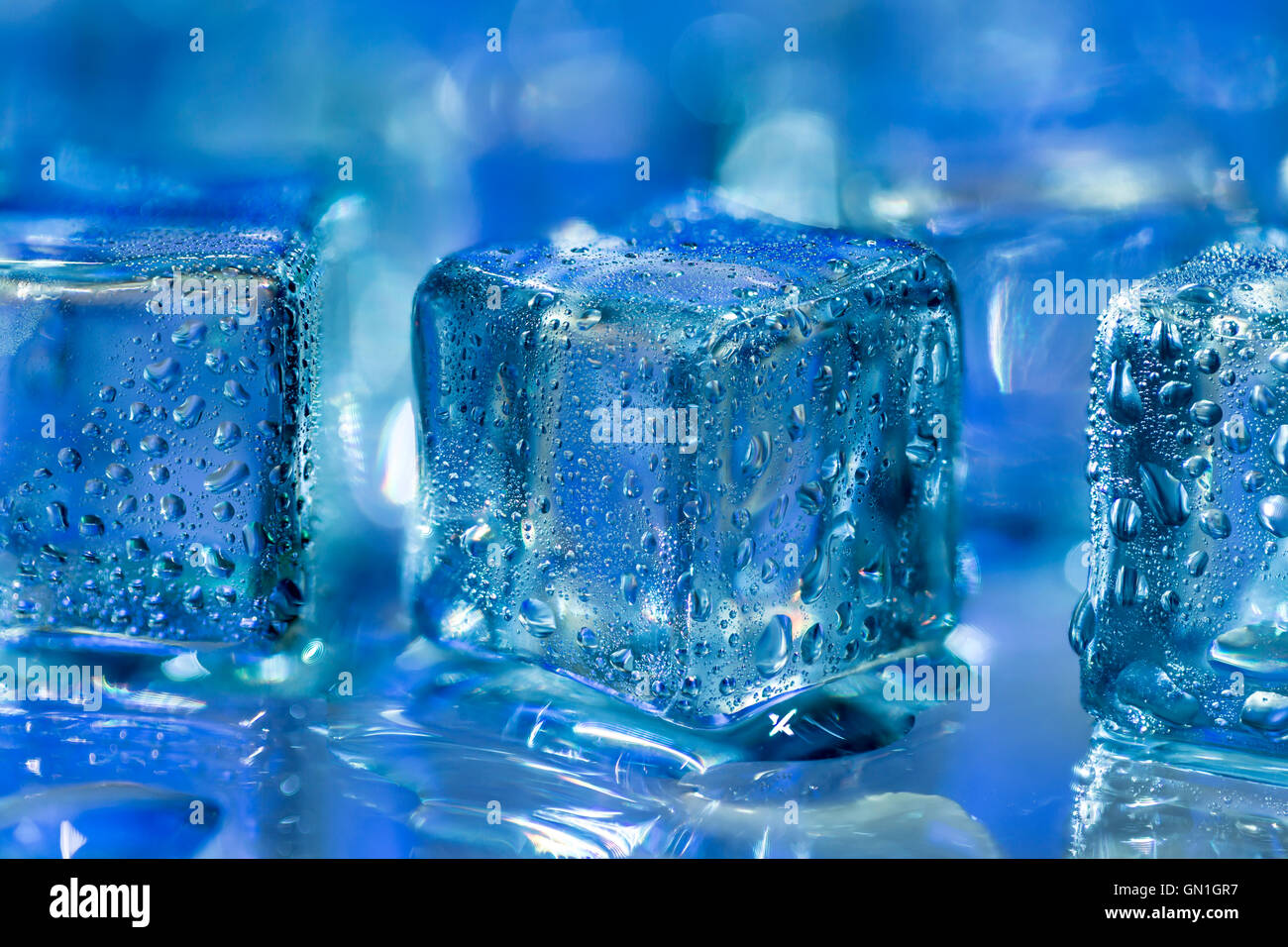 Melting transparent ice cubes on glass Stock Photo - Alamy