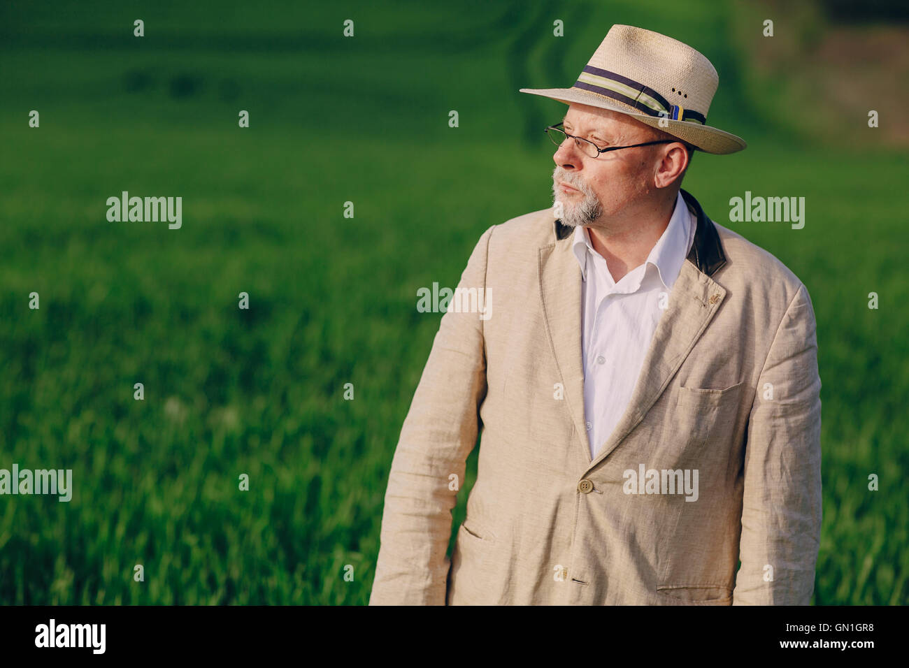 old man in field Stock Photo - Alamy