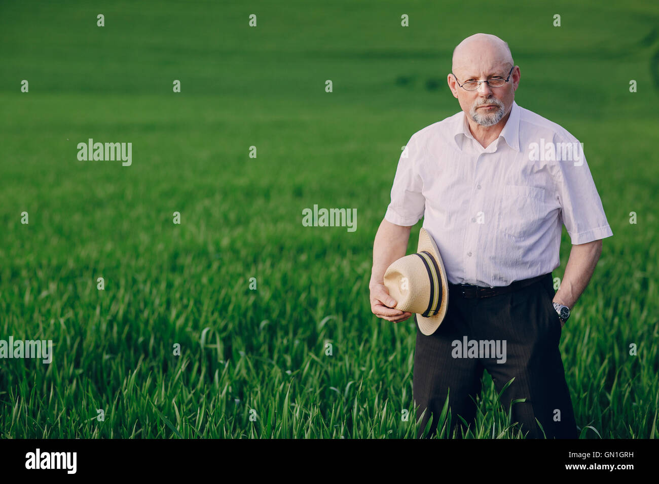 old man in field Stock Photo - Alamy