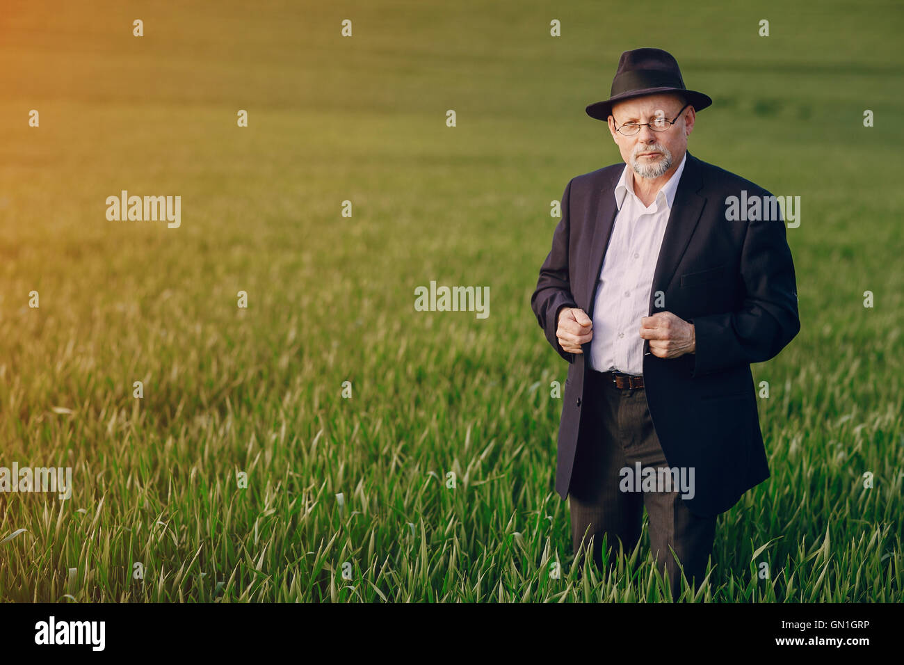 old man in field Stock Photo - Alamy